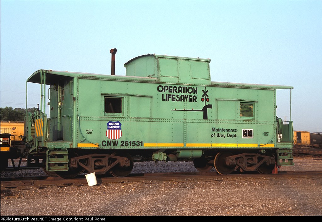 CNW 261531 now painted UP MofW Operation Lifesaver rests at Proviso Yard